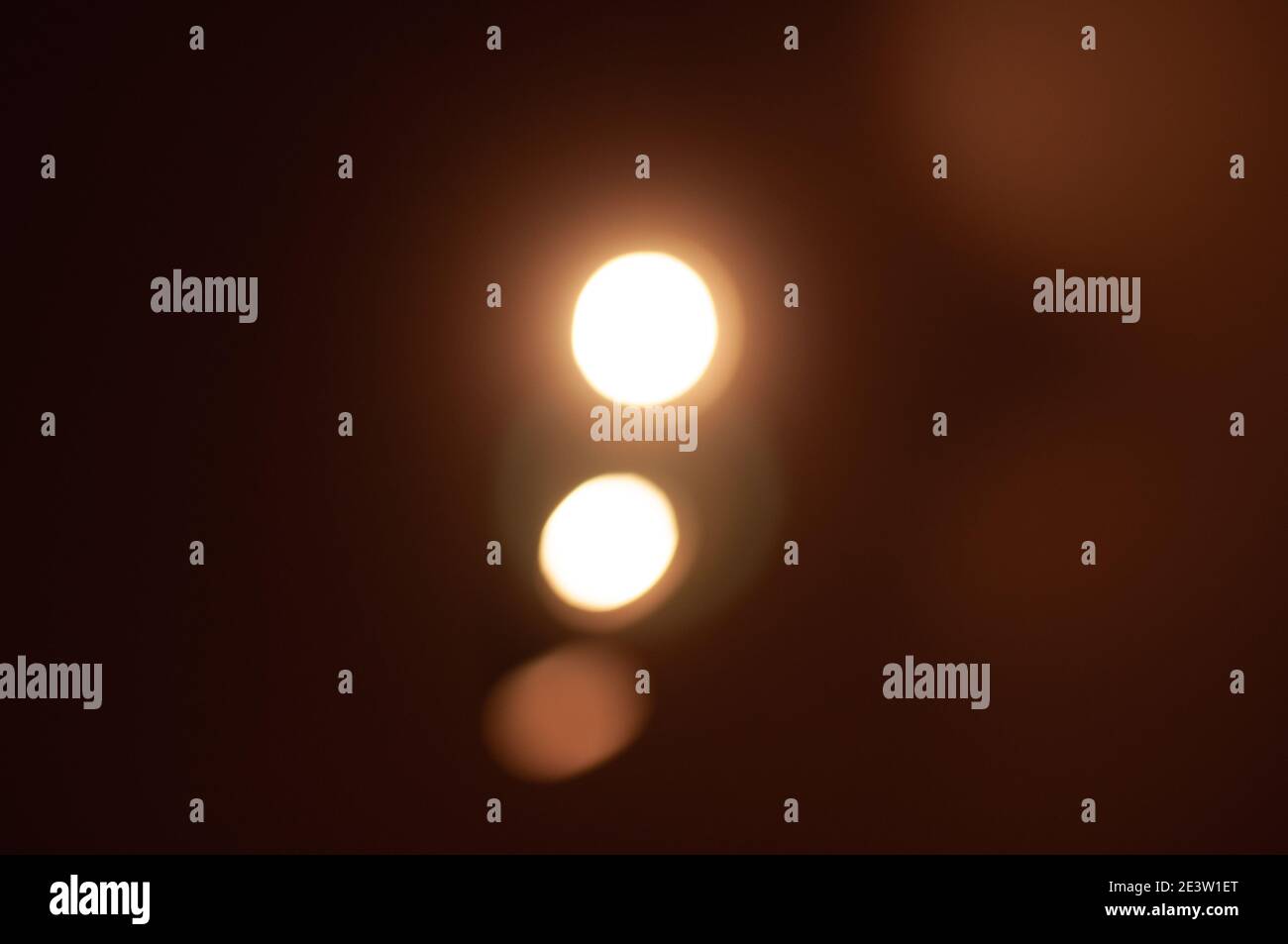 light from a source of yellow lanterns on a dark background Stock Photo ...