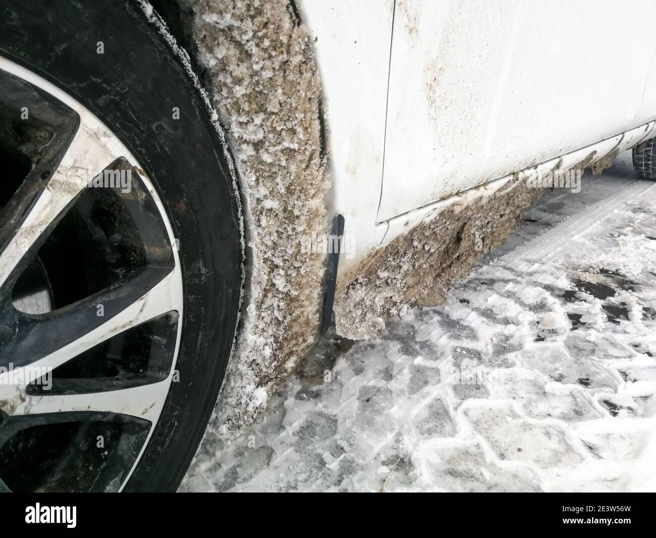 The wheel arch of the car is clogged with ice and snow. Consequences of ...