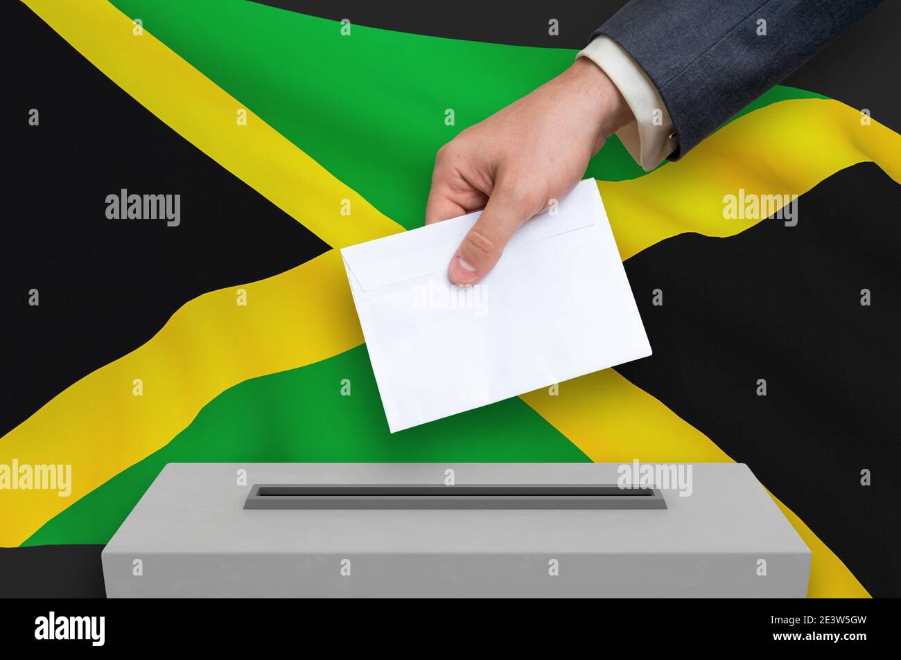 Election in Jamaica - voting at the ballot box. The hand of man is ...