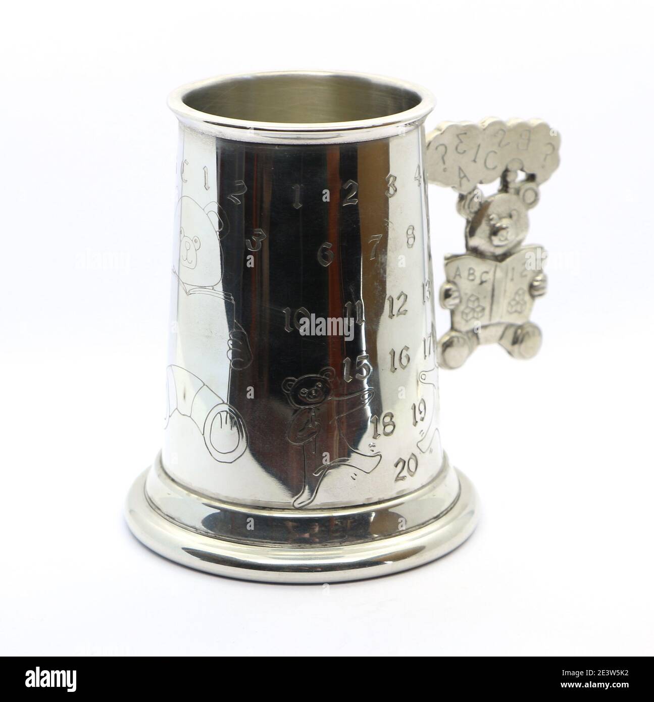 Photo of a Silver plated engraved with numbers letters and teddy bears ...