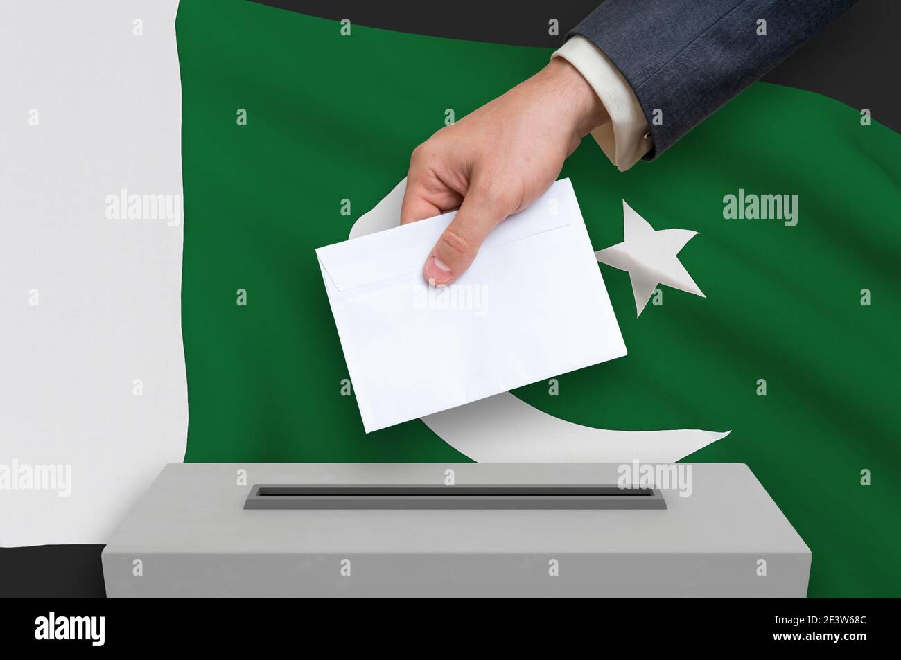 Election in Pakistan - voting at the ballot box. The hand of man is ...