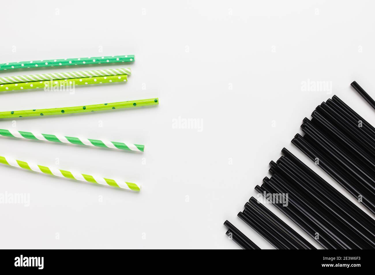 Plastic and paper straws on white background, environment concept Stock ...