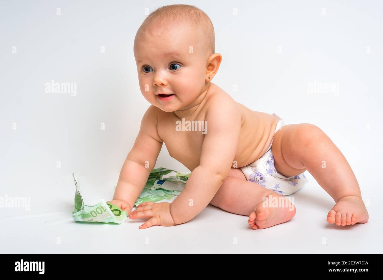 Cute baby with euro bills money isolated on white background Stock ...