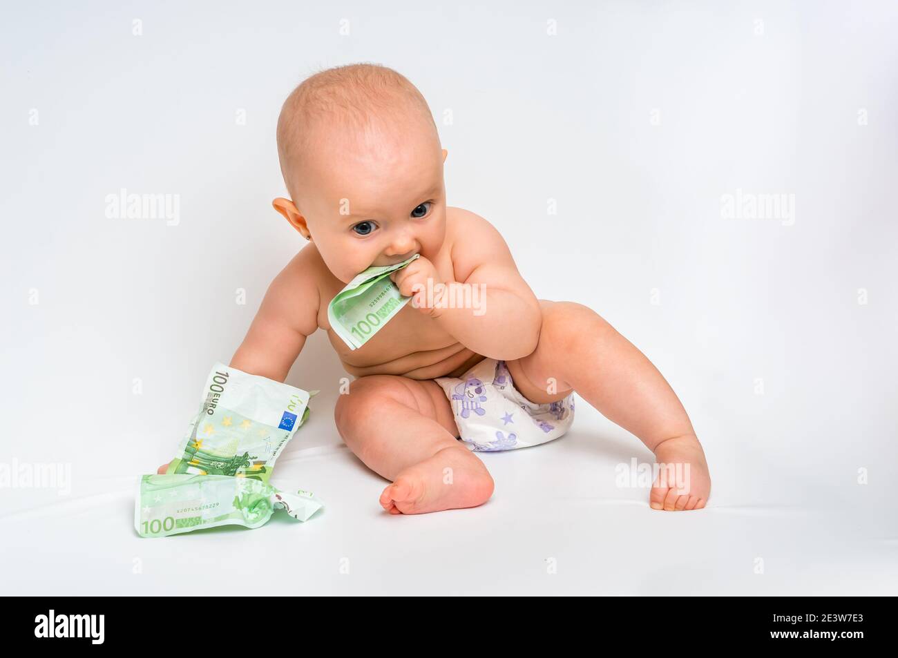 Cute baby with euro bills money isolated on white background Stock ...
