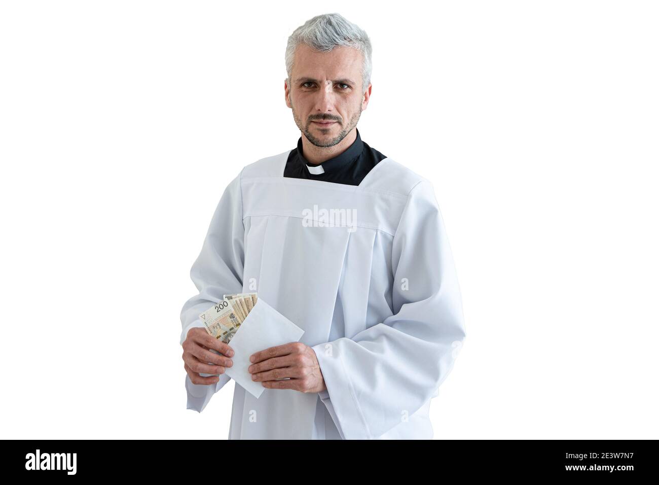 Polish catholic priest holding Polish money zloty during pastoral visit ...