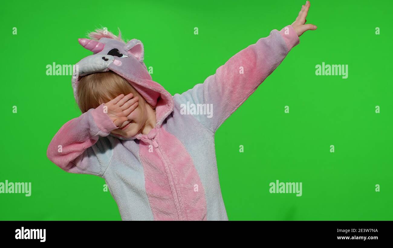 Child smiling, dancing, celebrating, performing dab dance in unicorn ...