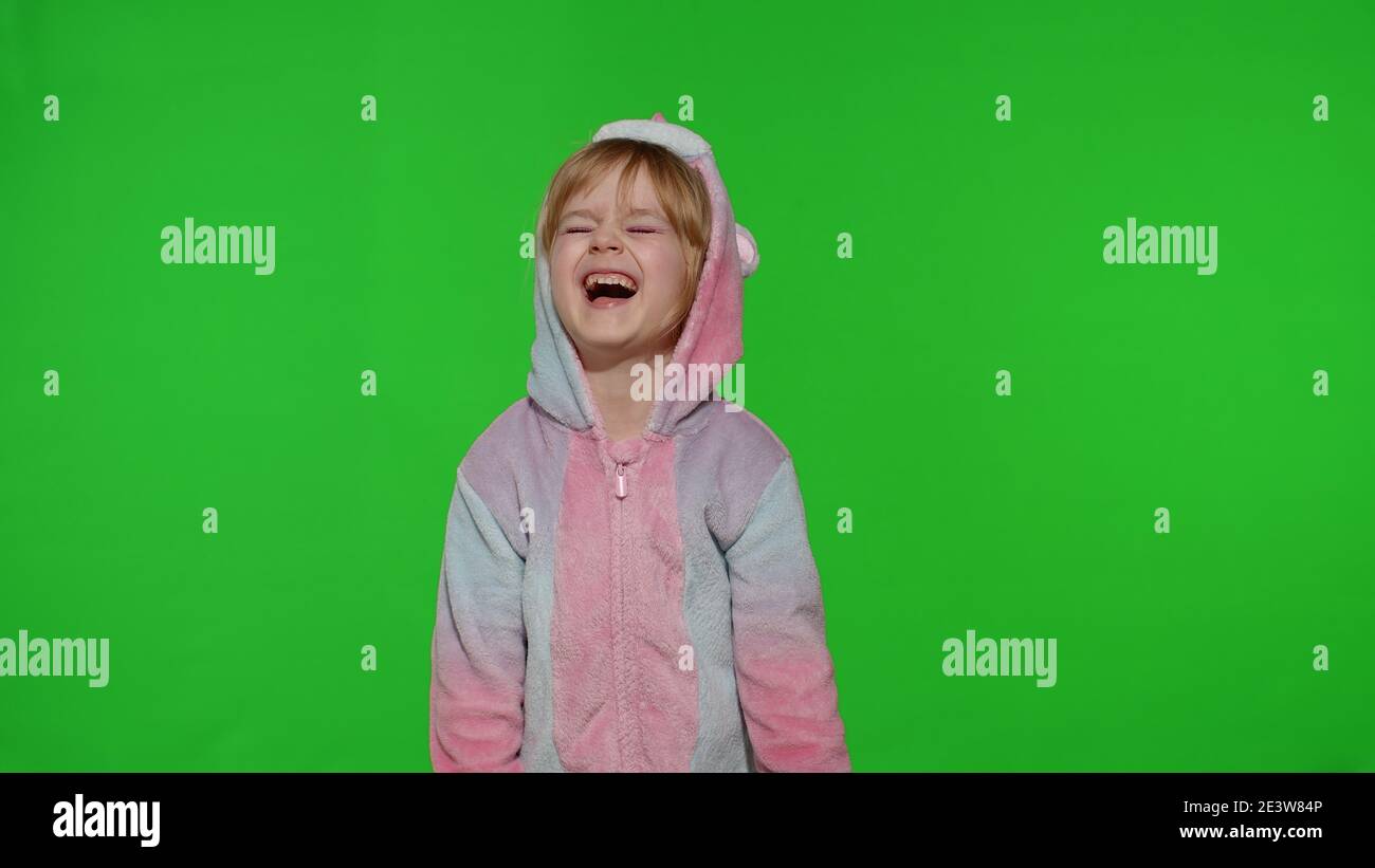 Young little blonde child 5-6 years old in unicorn costume crying with ...