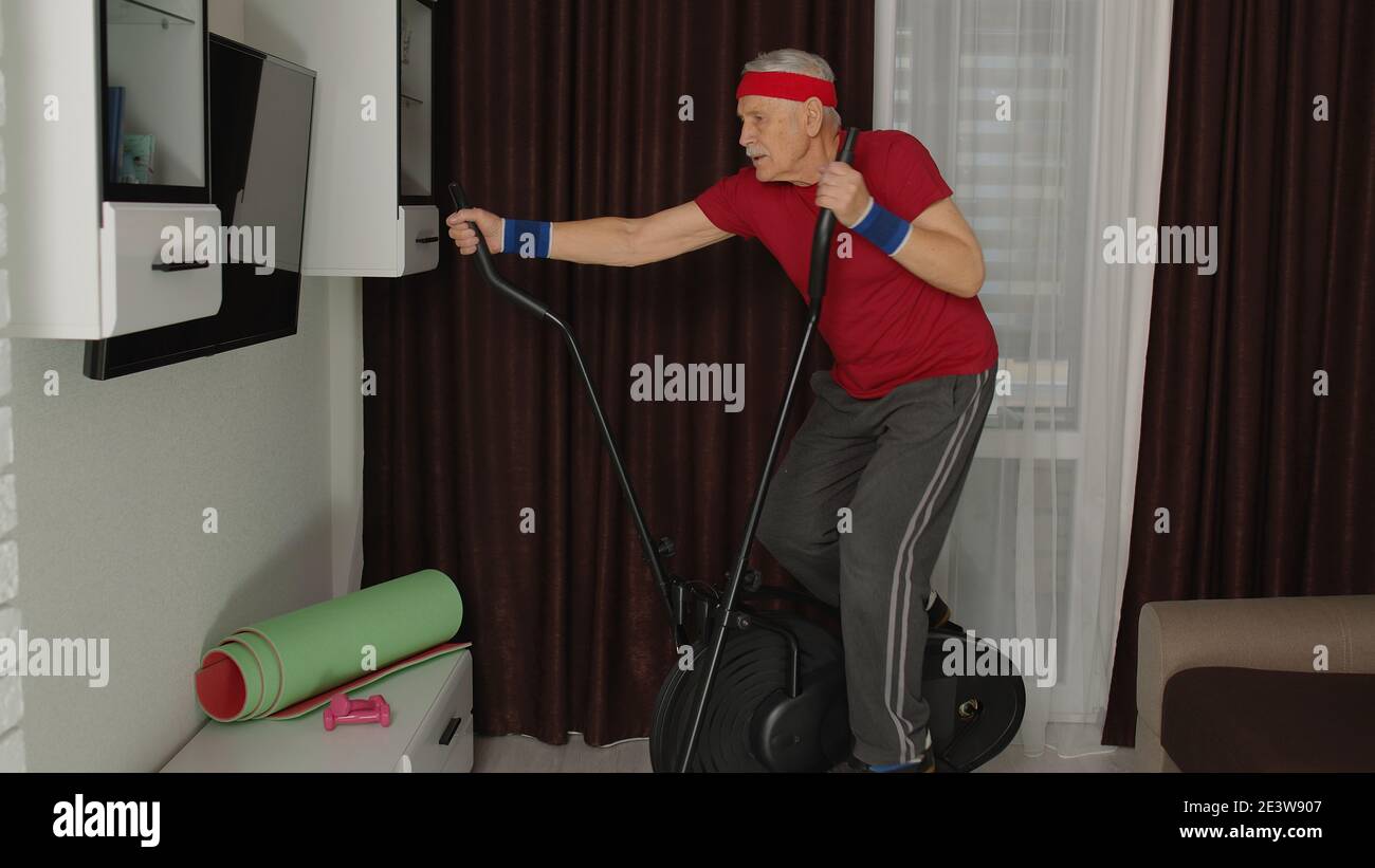 Senior man using orbitrek fitness hi-res stock photography and images ...