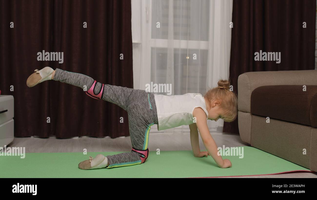 Fit little child kid training gymnastics fitness stretching workout on ...