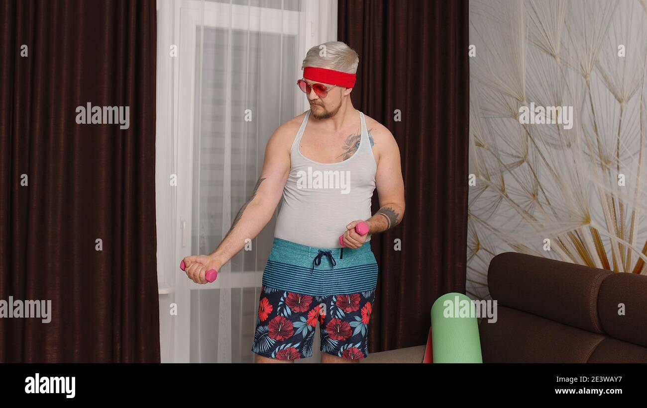 Stylish hipster man blogger trainer recording sport weightlifting ...