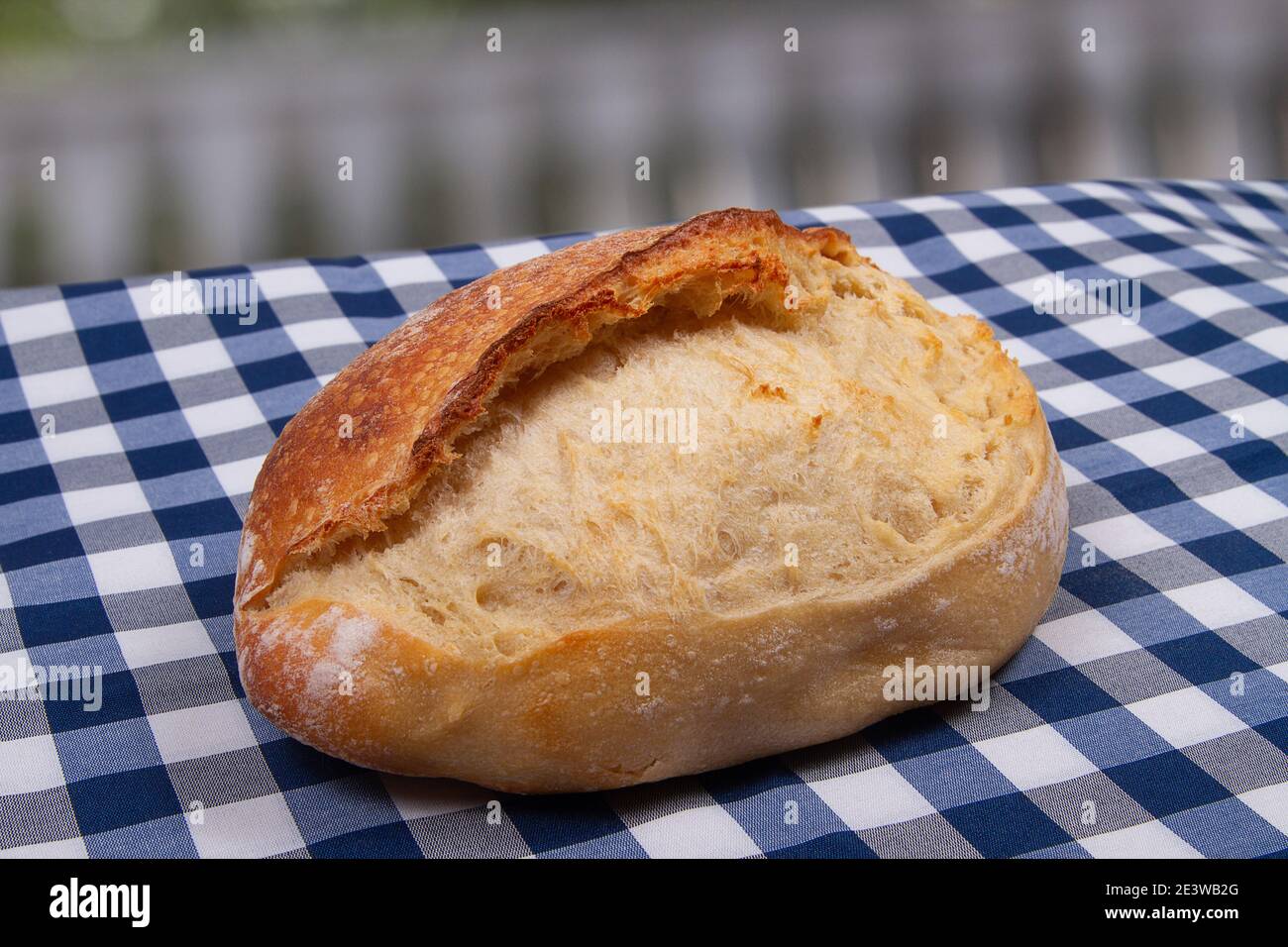 whole Loaf of homemade white bread on rustic checkered blue white ...