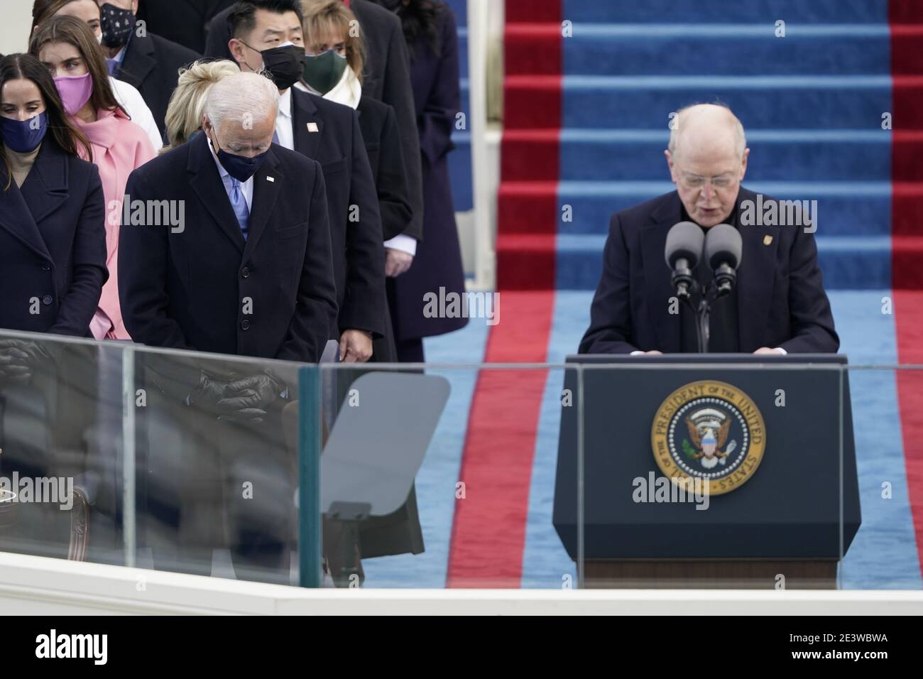 President-elect Joe Biden bows his head during a prayer during the 59th ...