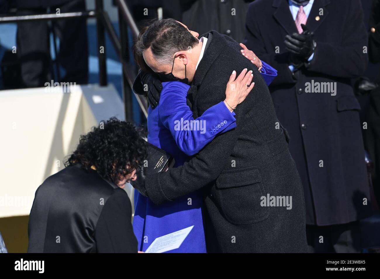 US Vice President-elect Kamala Harris (L) embraces US Second Gentleman ...