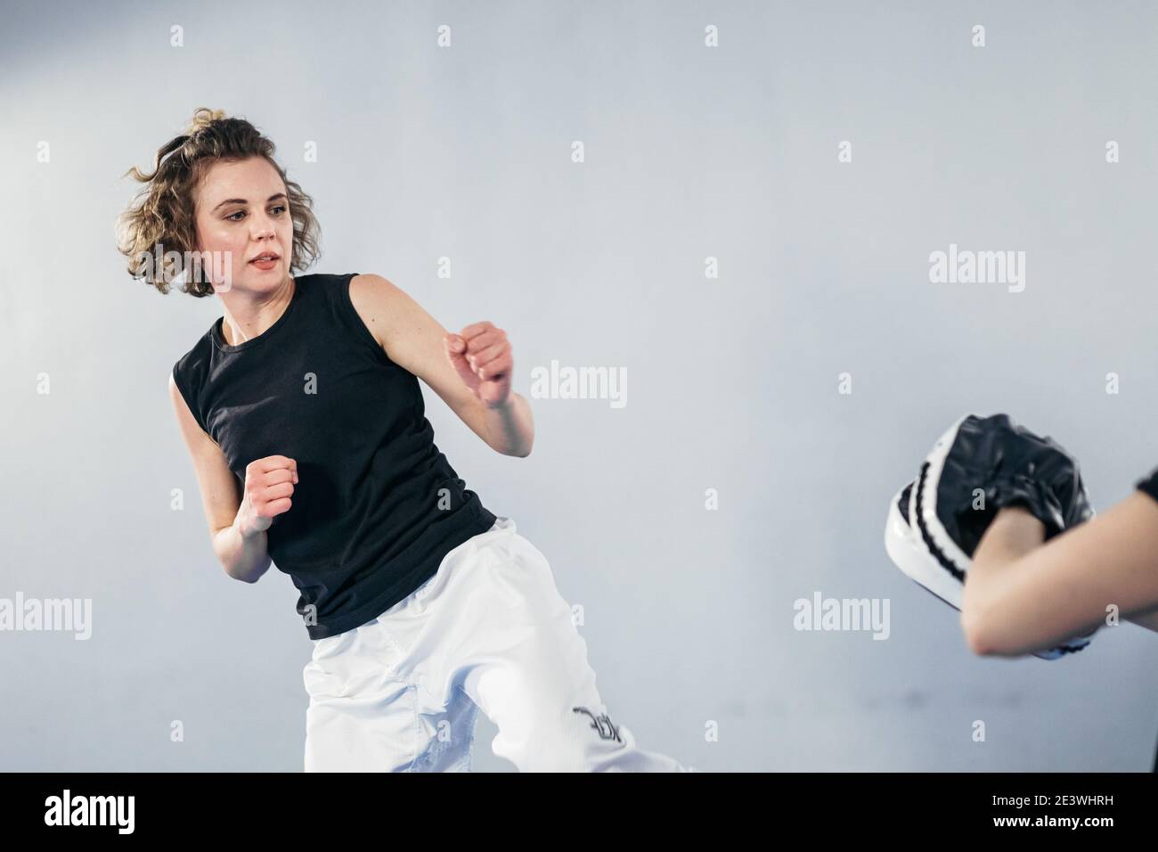 Taekwondo professional athlete woman kicks hi-res stock photography and ...