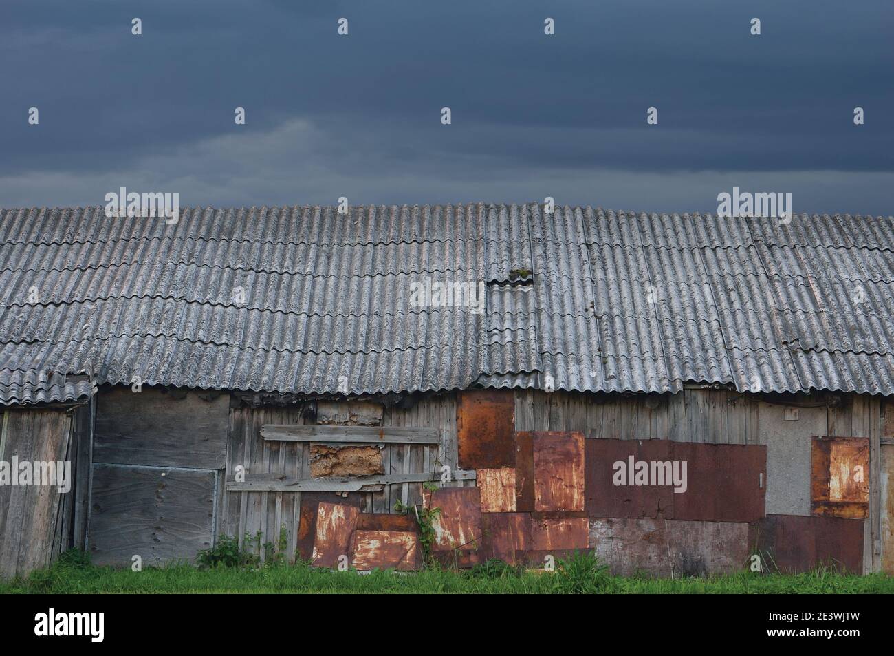 Old aged weathered wooden shack, grey plated wood boarding hut wall ...