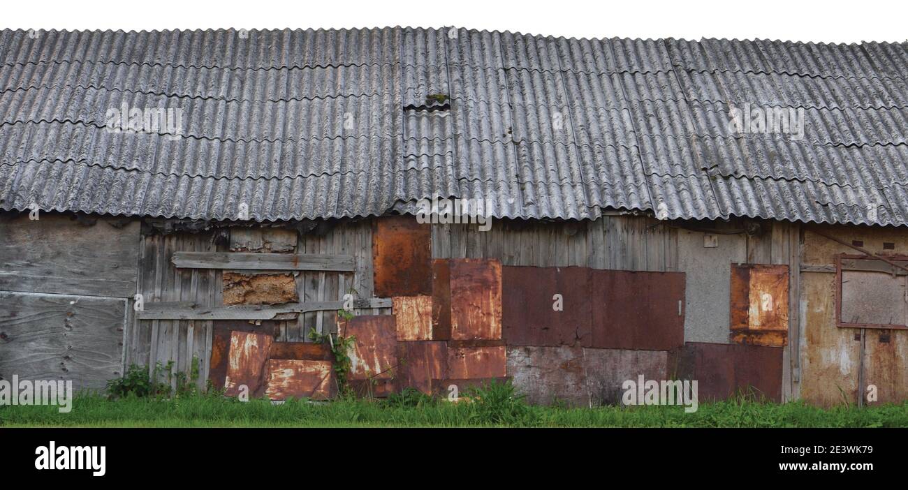 Old aged weathered wooden shack, grey plated wood boarding hut wall ...