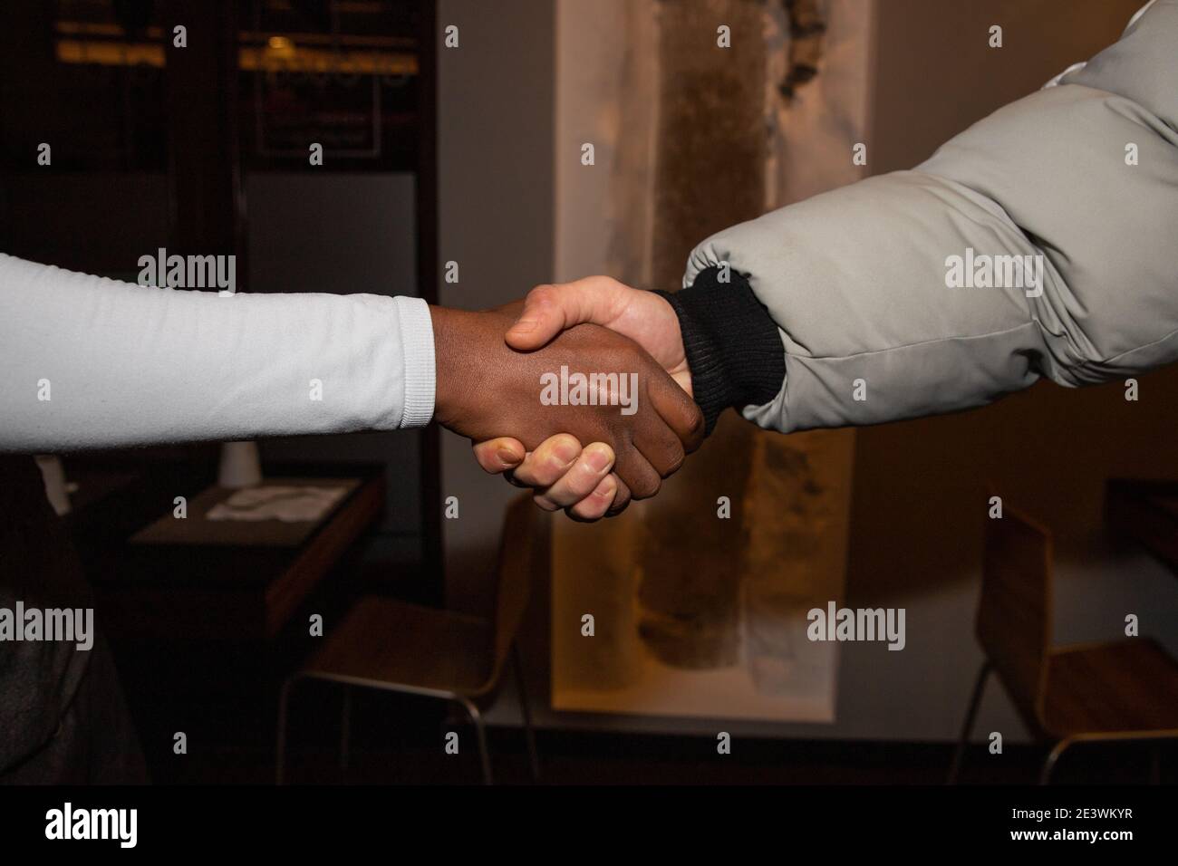 Interracial handshake hi-res stock photography and images - Alamy