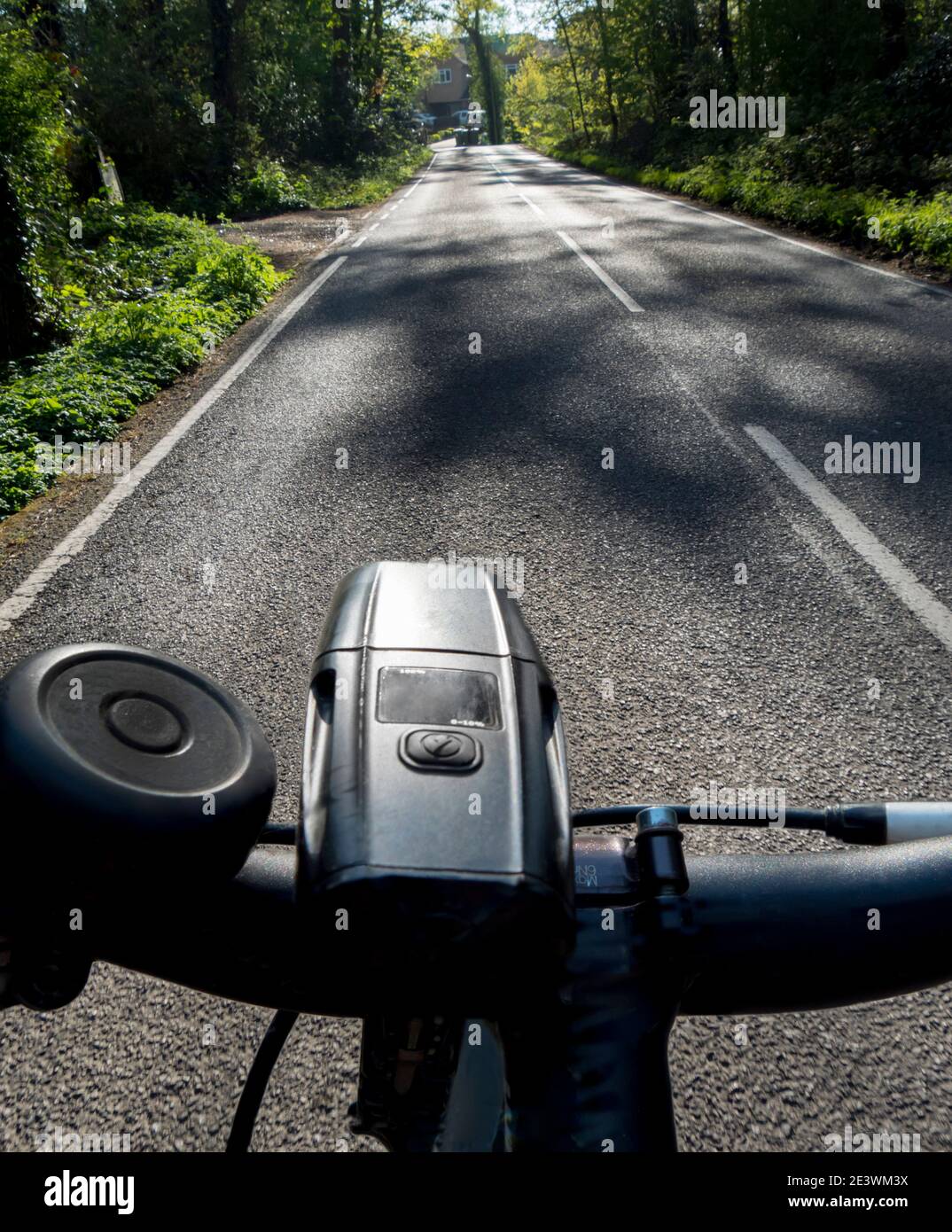 Cycling light along straight road Stock Photo - Alamy