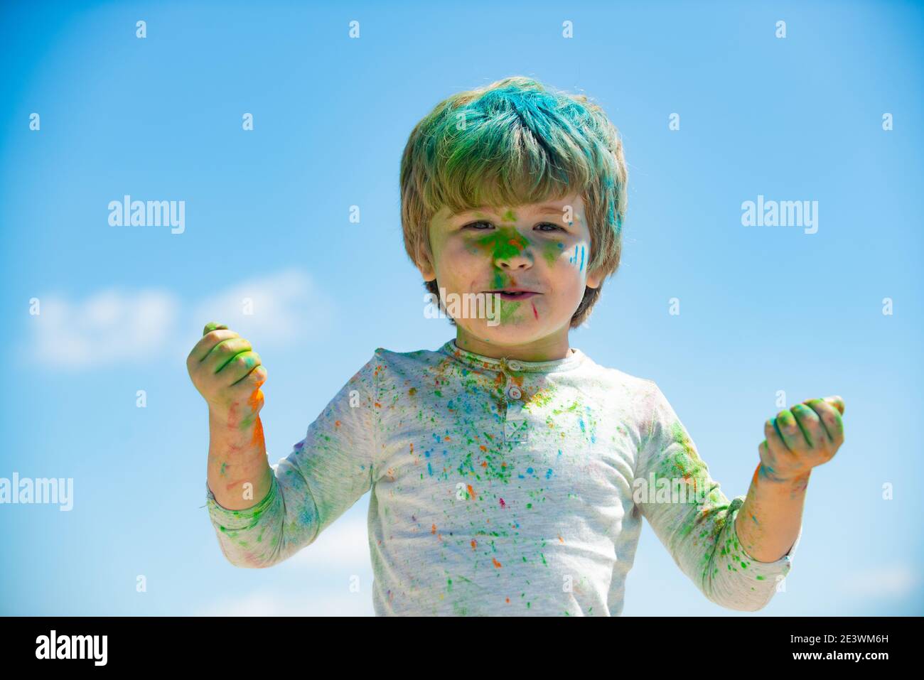 Kids Holi festival of colors.. Painted face of smiling kid. Little boy ...