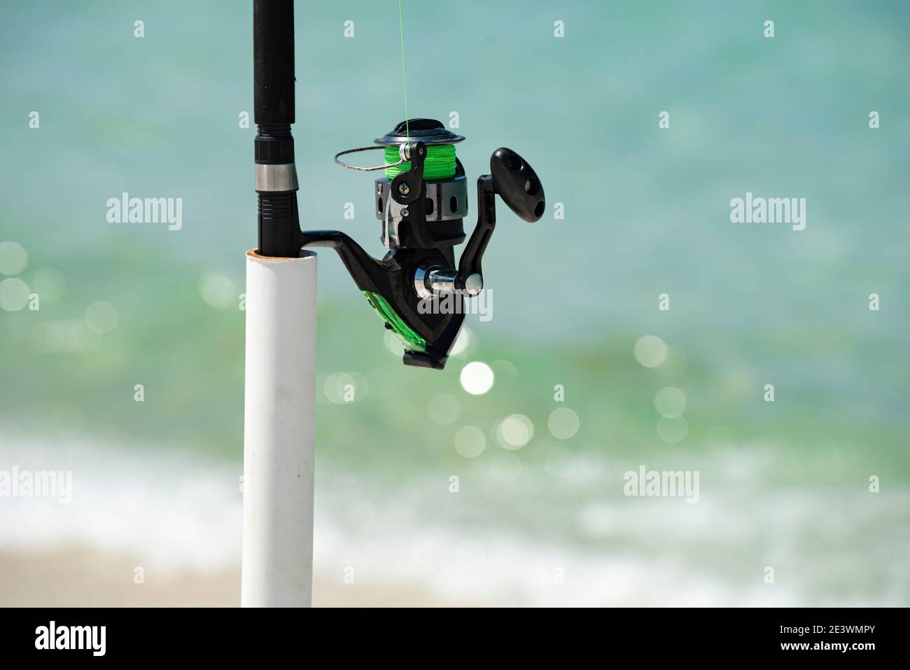 Summer vacation. Fishing rod at sea. Spinner, fish-rod. Relaxing ...