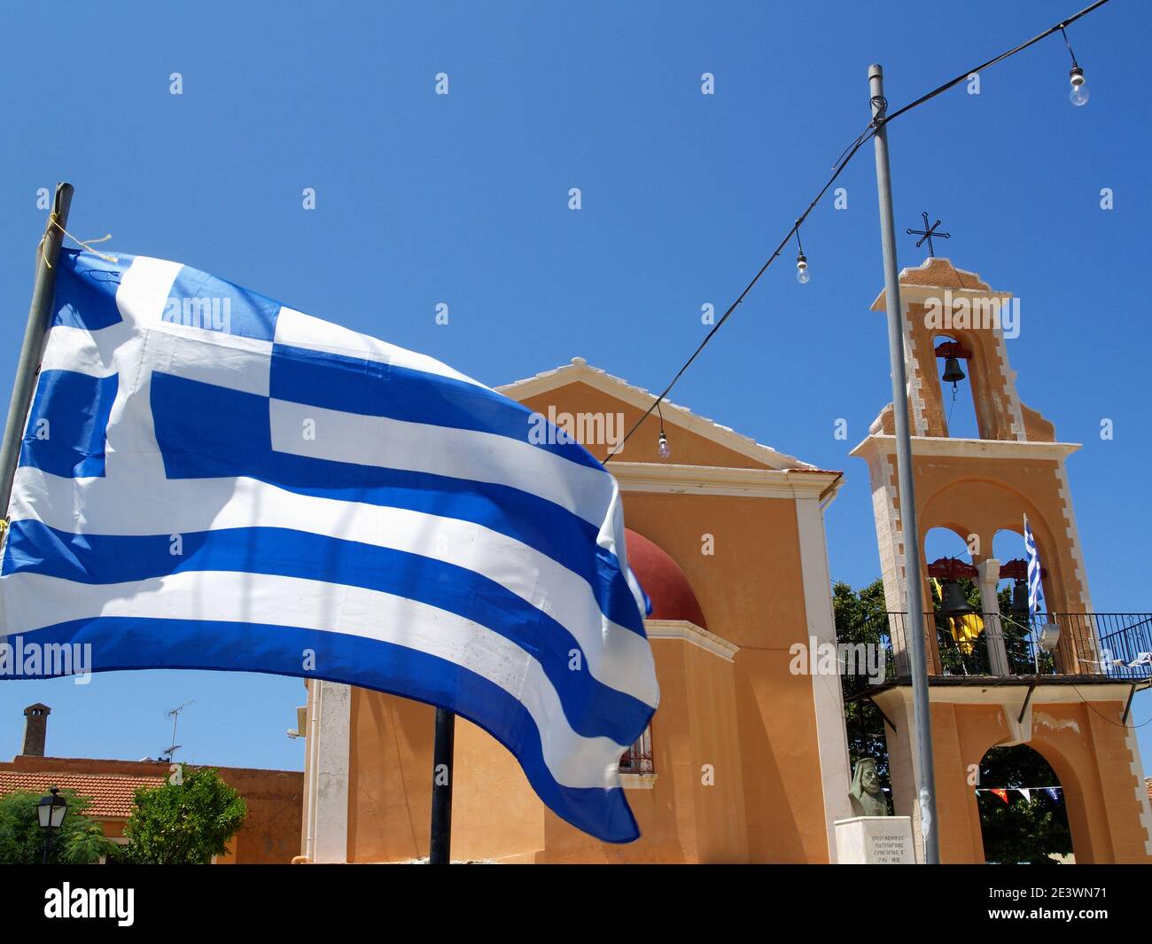 Greek flag flying outside church in Xanthates, Corfu, Greece Stock ...