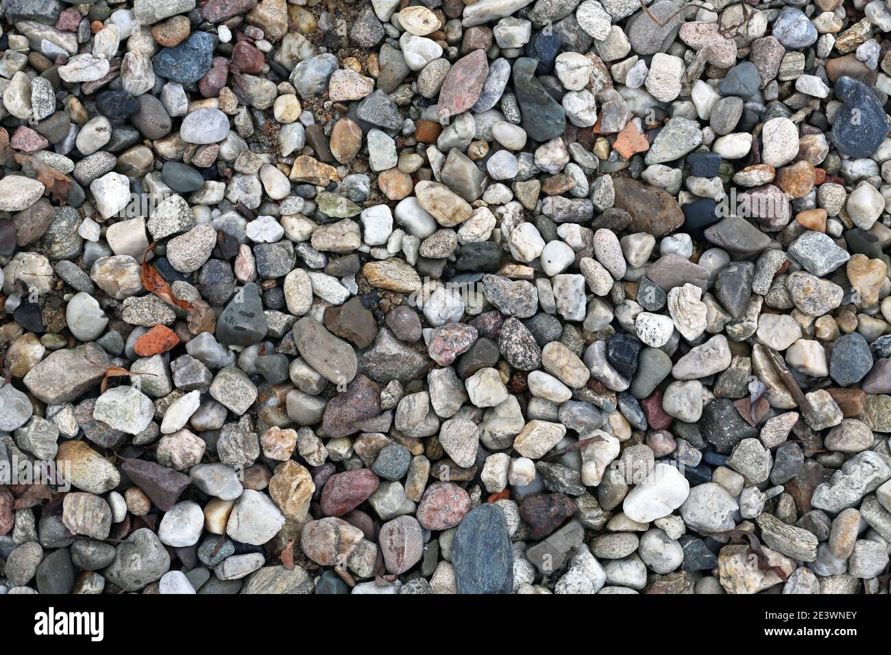 Rocky background with round stones in grey colours Stock Photo - Alamy