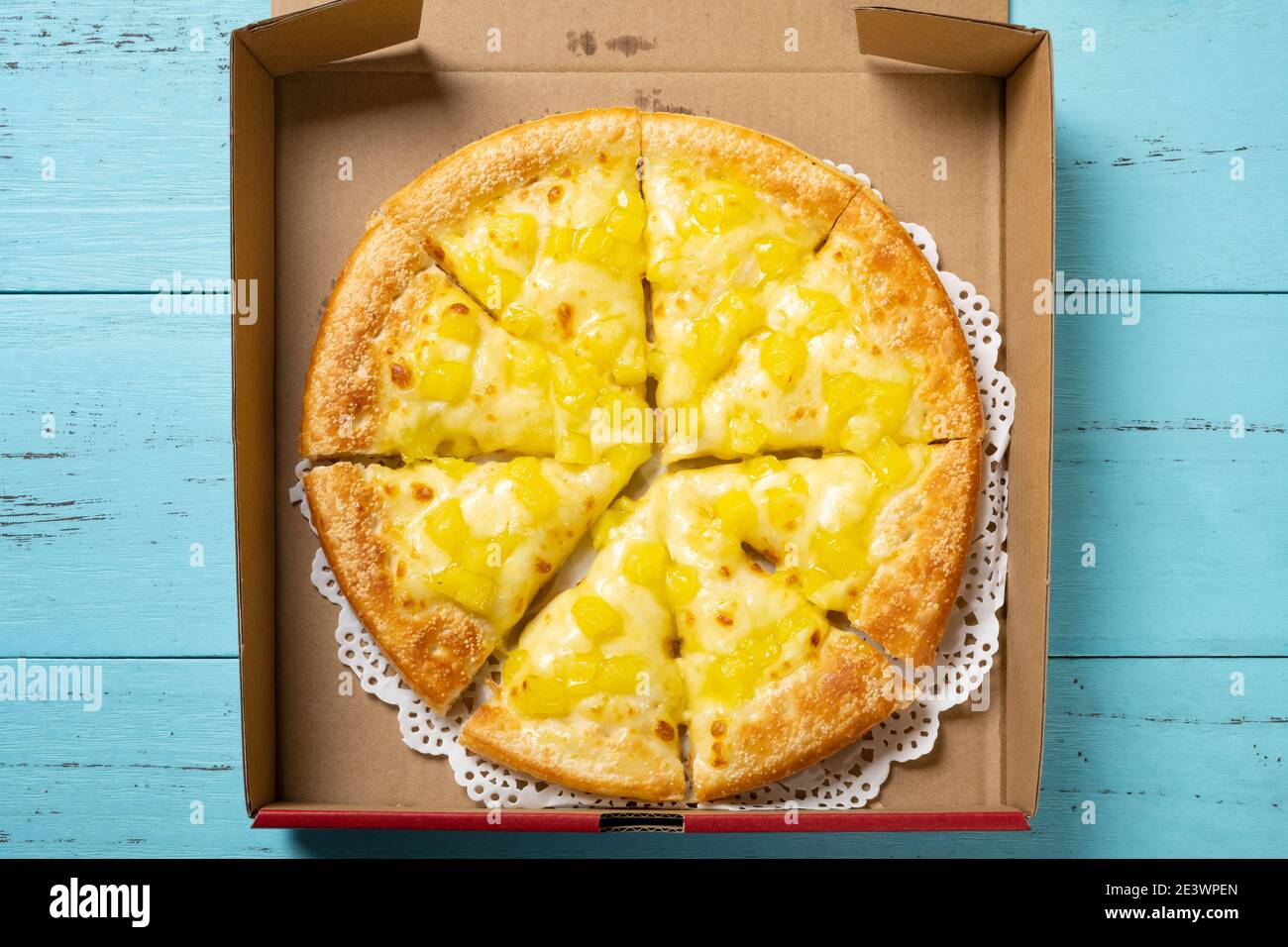 top view fresh pizza with fruit toppings in a box Stock Photo - Alamy