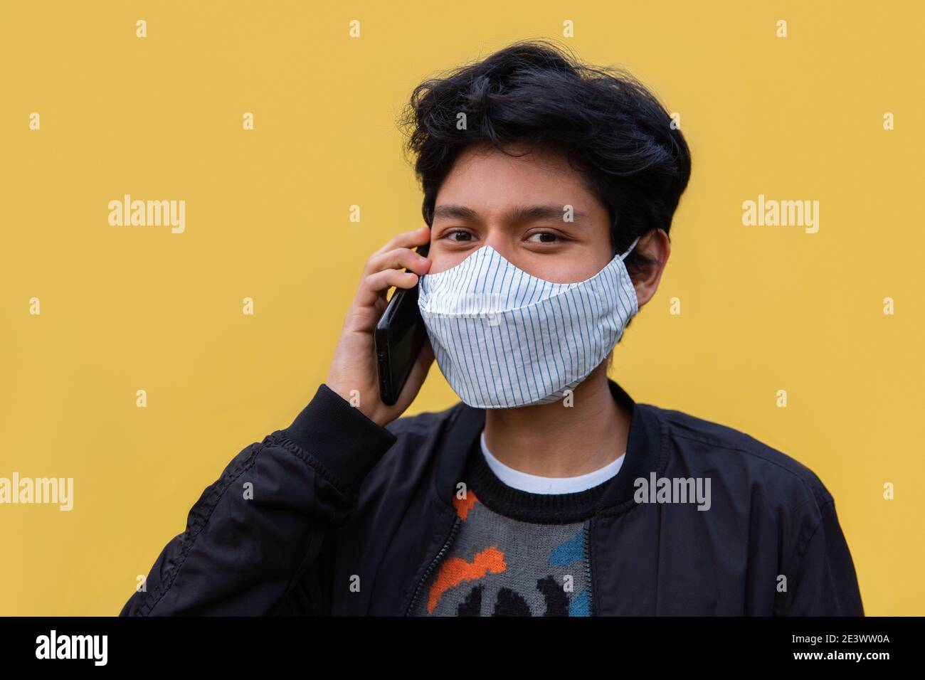 Latin young man mask walking hi-res stock photography and images - Alamy