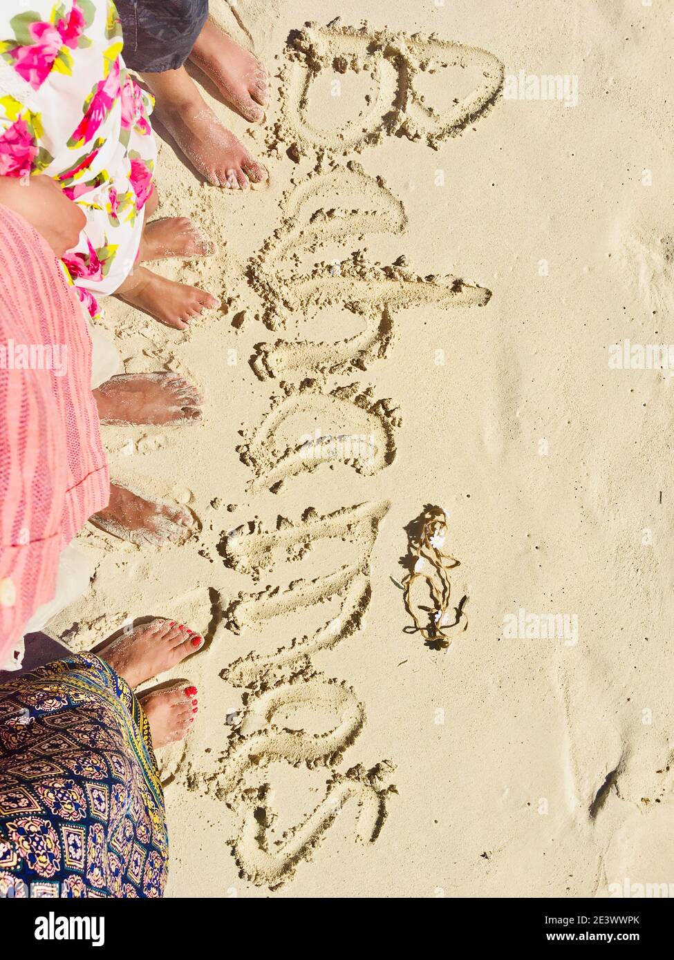 Woman writing on sand hi-res stock photography and images - Alamy