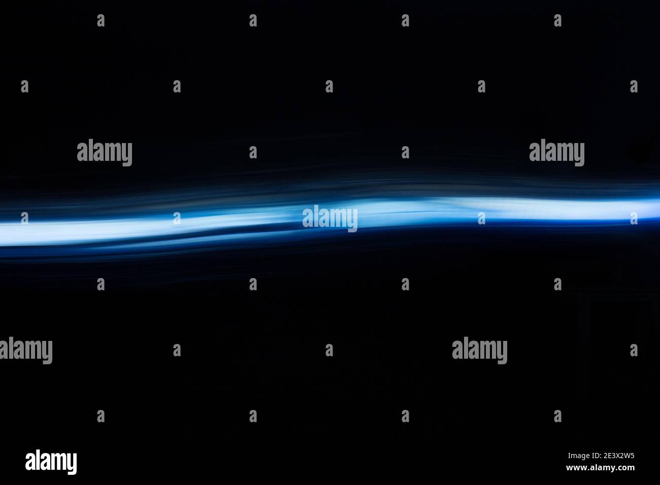 Glowing shiny curve light trail lines effect in black background Stock ...