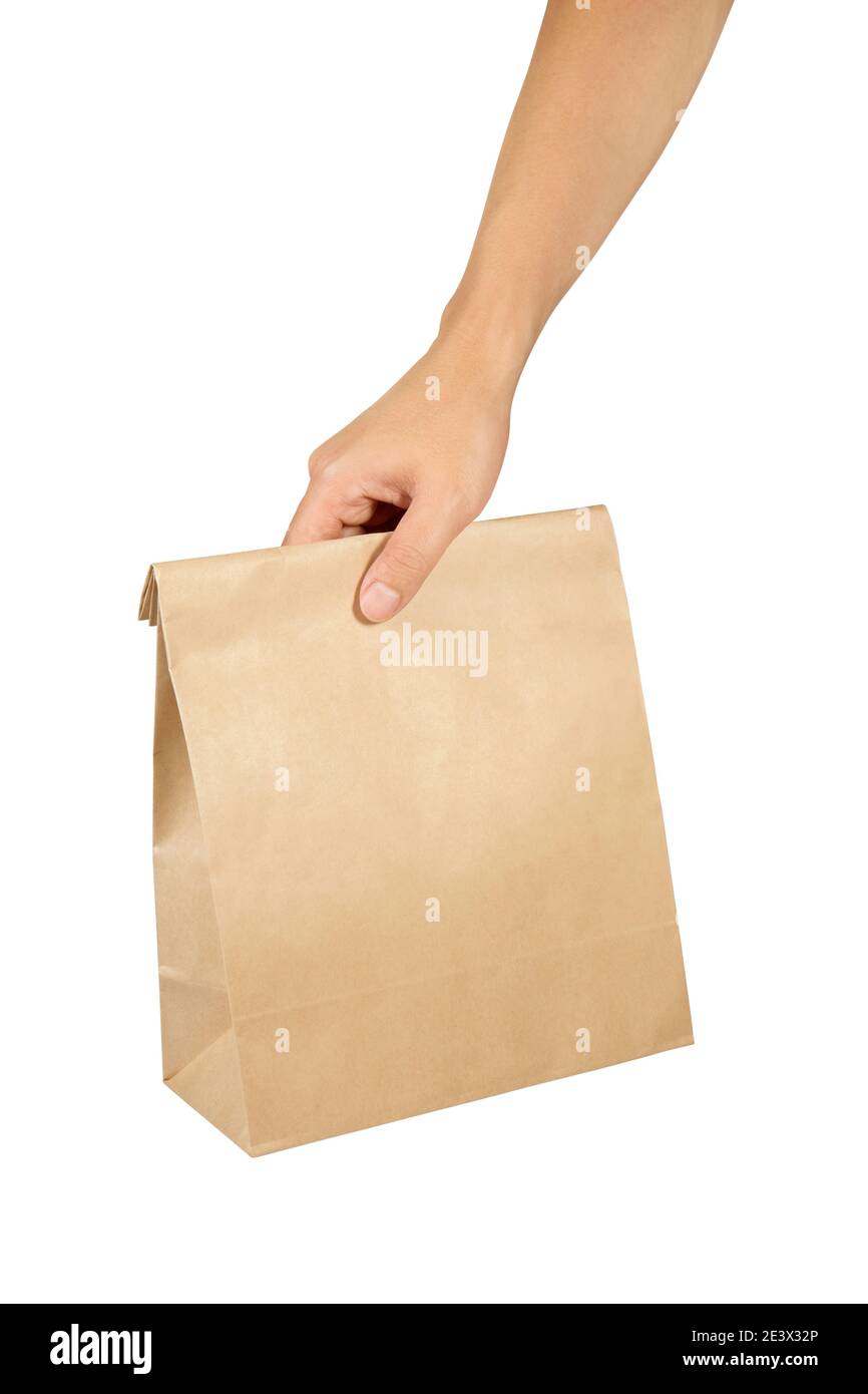 Right hand holding a brown paper bag isolated on white with clipping ...