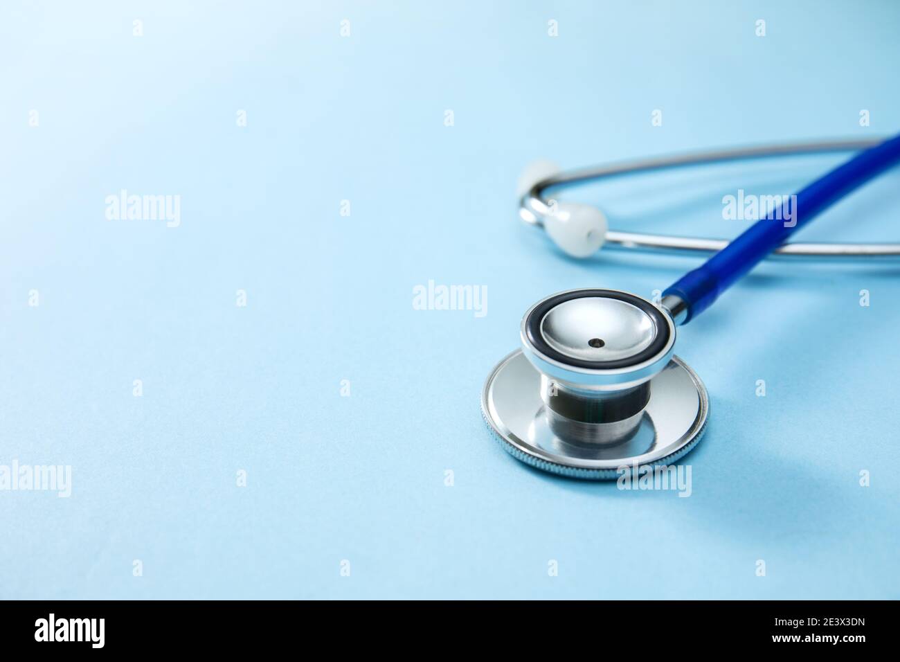 Stethoscope on Blue Background Stock Photo - Alamy