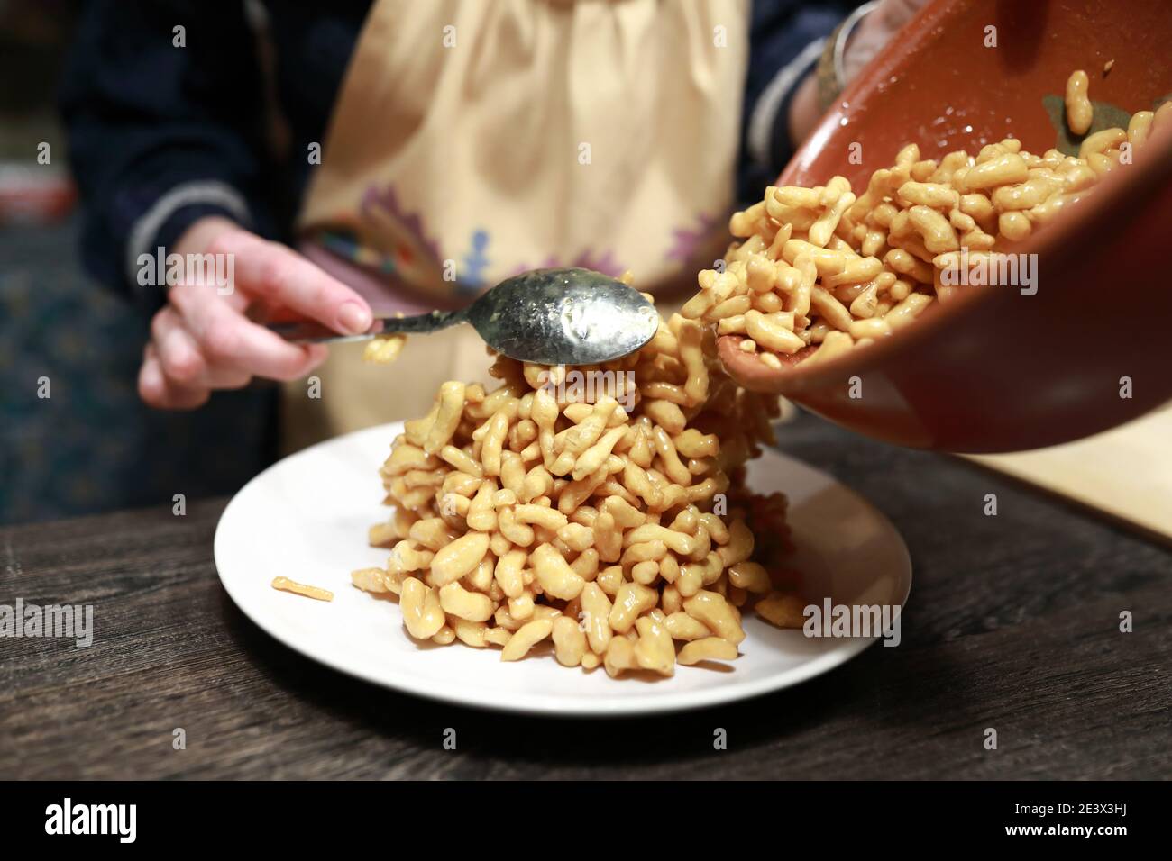 Woman puts on table plate hi-res stock photography and images - Alamy