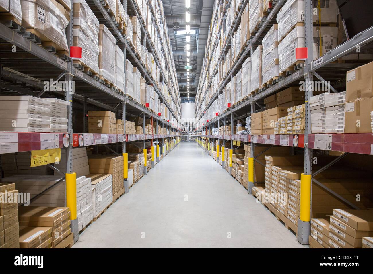 Rows of shelves with goods boxes in modern industry warehouse store at ...