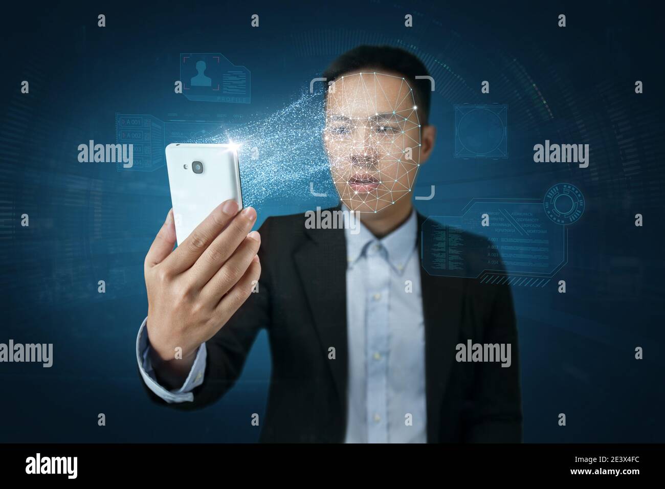Young modern man in suit using facial recognition with smartphone Stock ...