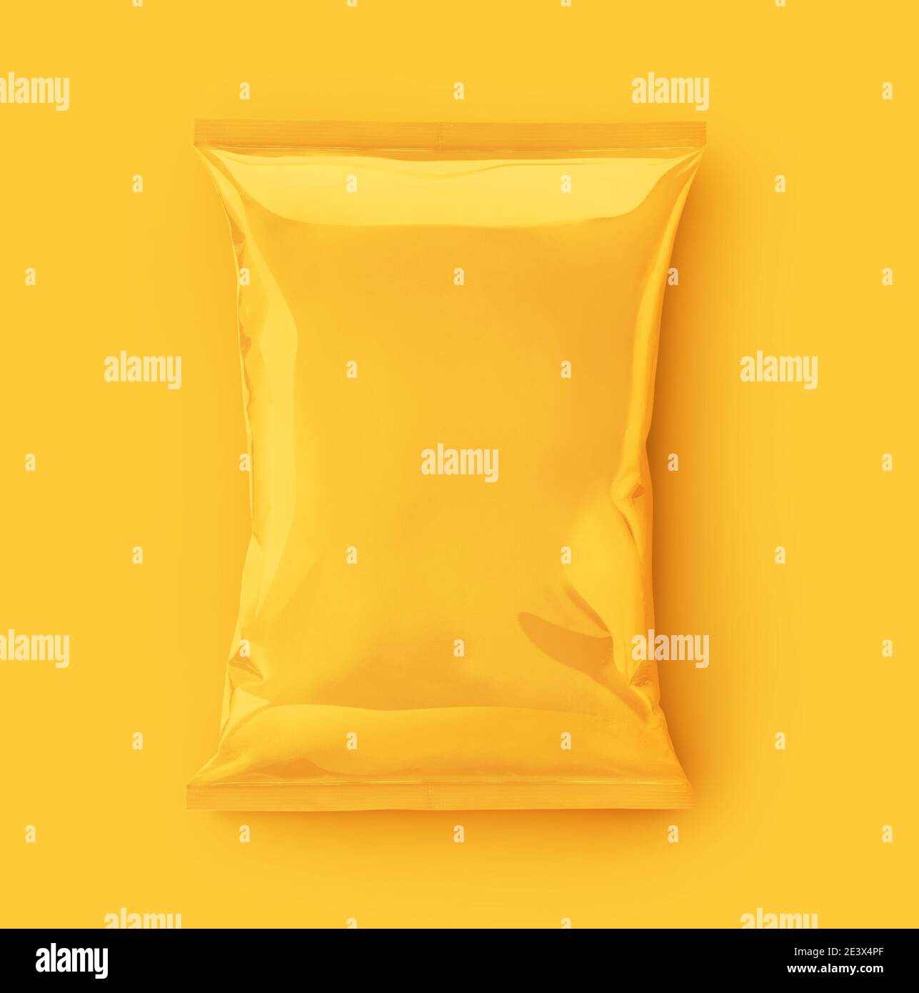 Yellow plastic bag snack packaging in yellow background Stock Photo - Alamy