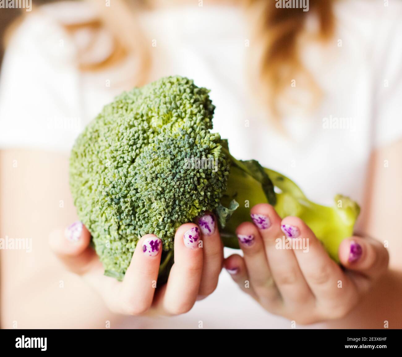 Healthy Green Organic Raw Broccoli. Broccoli in child's hands. children ...