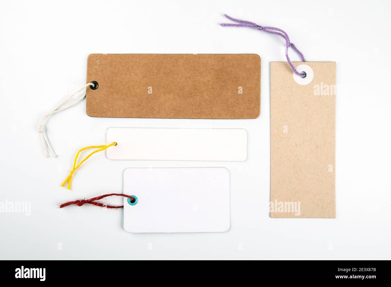 Cardboard and paper price tags on a white background. Copy space, mock ...