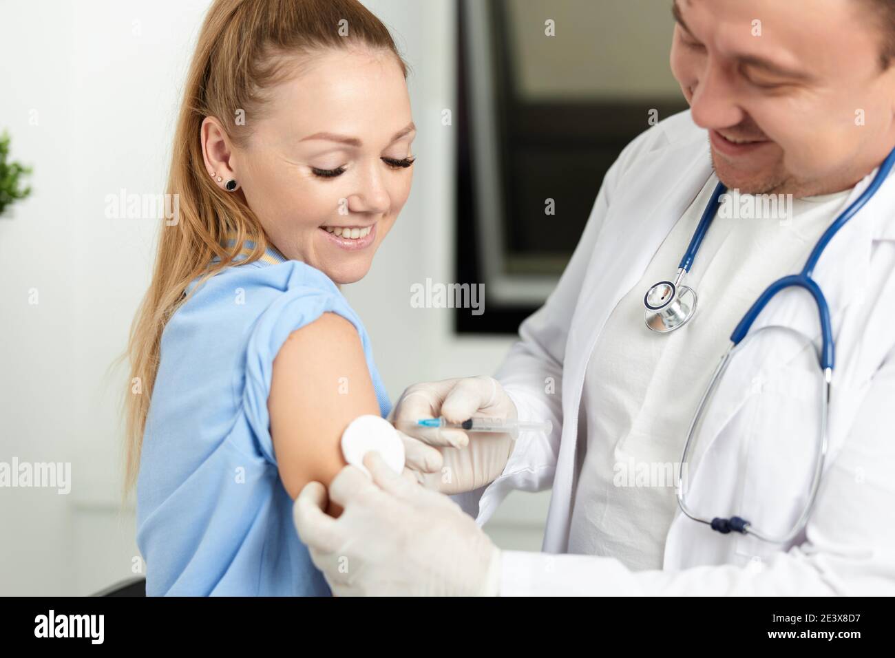 male doctor giving an injection to a patient vaccine health covid ...