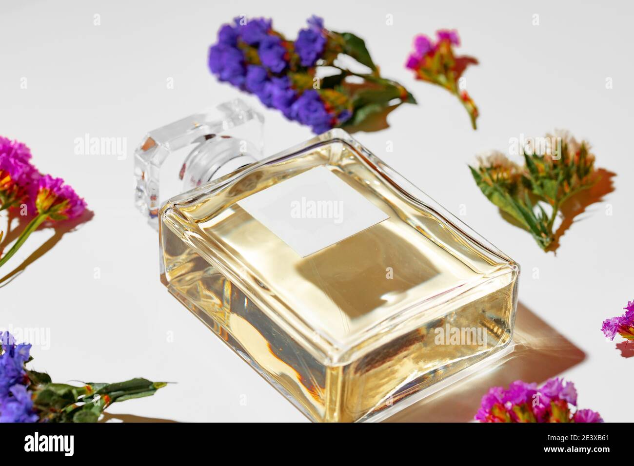 Perfume bottle for women in flower buds Stock Photo - Alamy