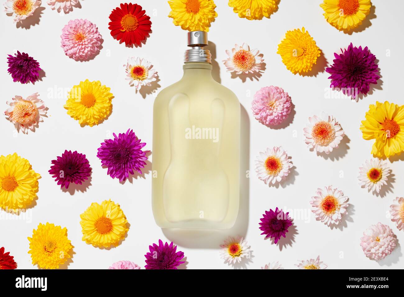 Perfume bottle for women in flower buds Stock Photo - Alamy