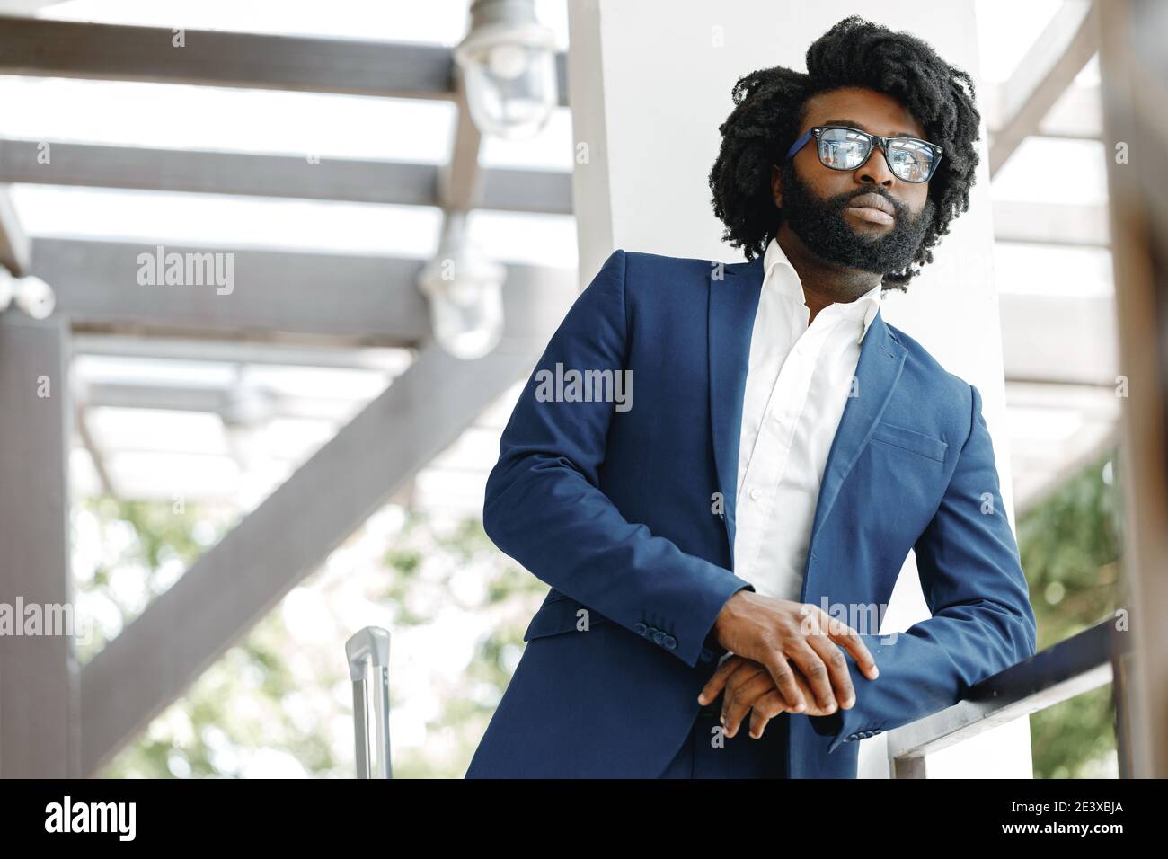 Portrait of african american businessman standing in hotel lobby Stock ...
