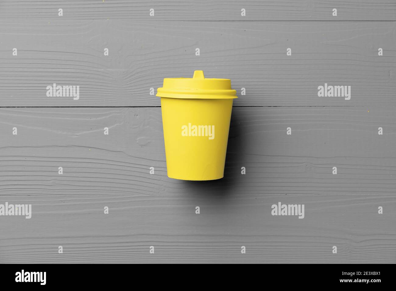 Disposable coffee cup in yellow gray colors Stock Photo - Alamy