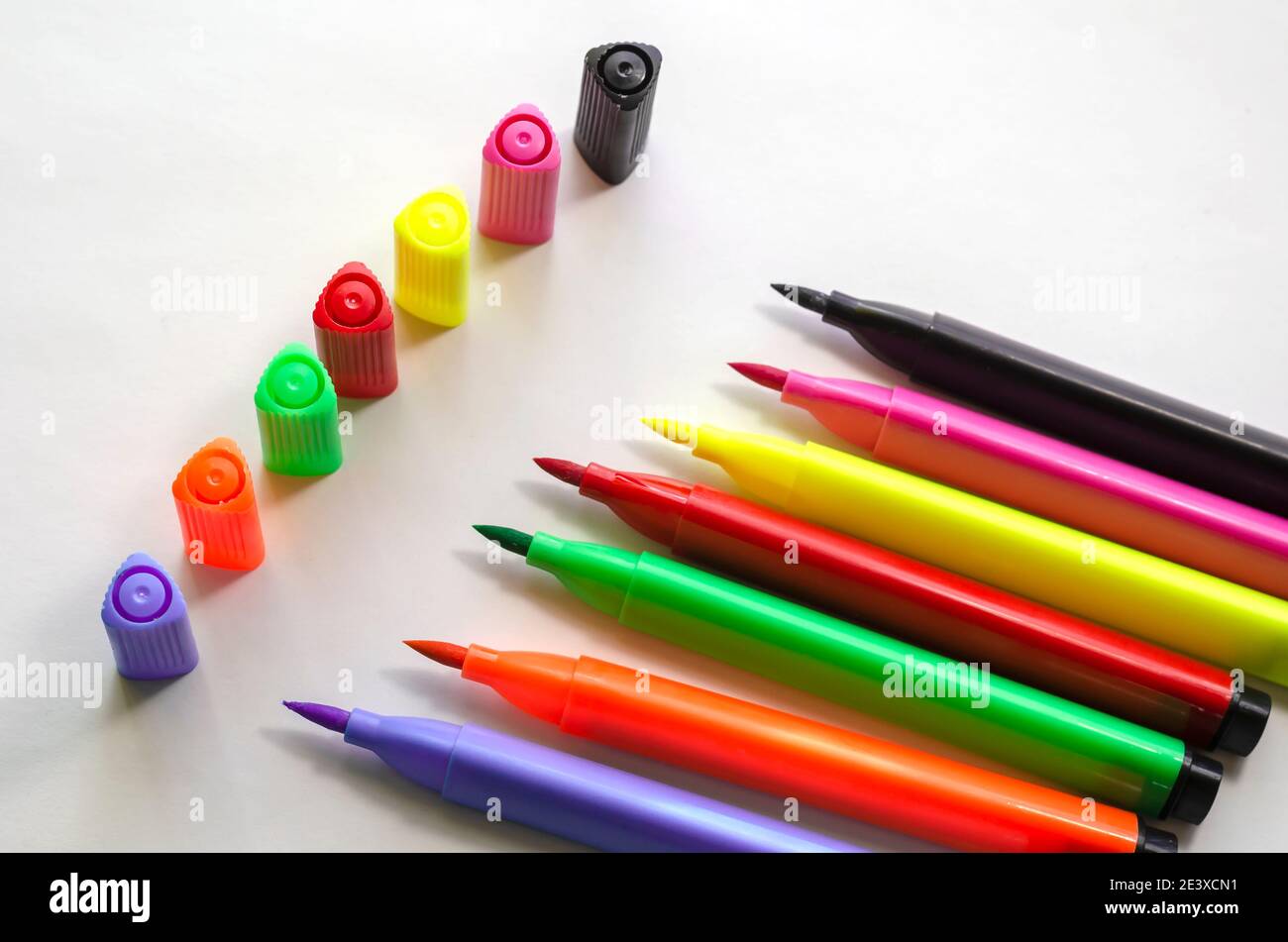 Set of new colorful felt-tip pens on white background. Seven brightly ...