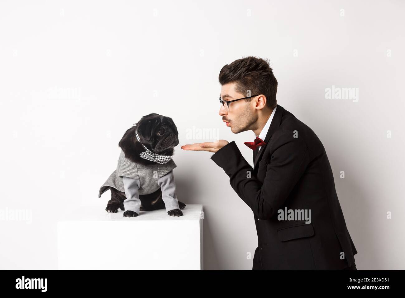 Pets, winter holidays and celebration concept. Handsome young man ...