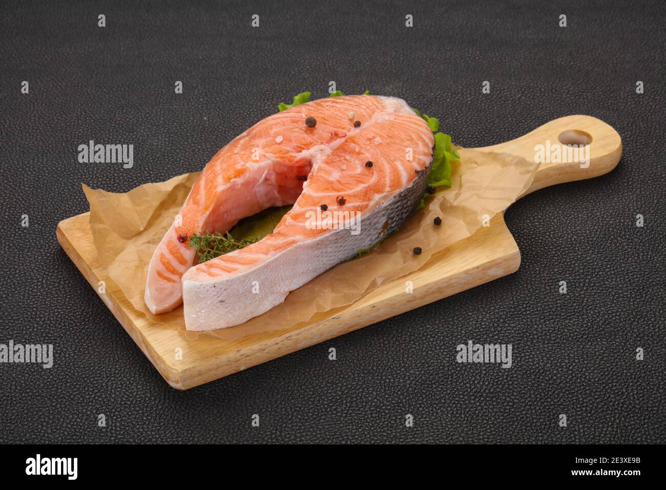 Raw salmon steak with salt and pepper - ready for grill Stock Photo - Alamy