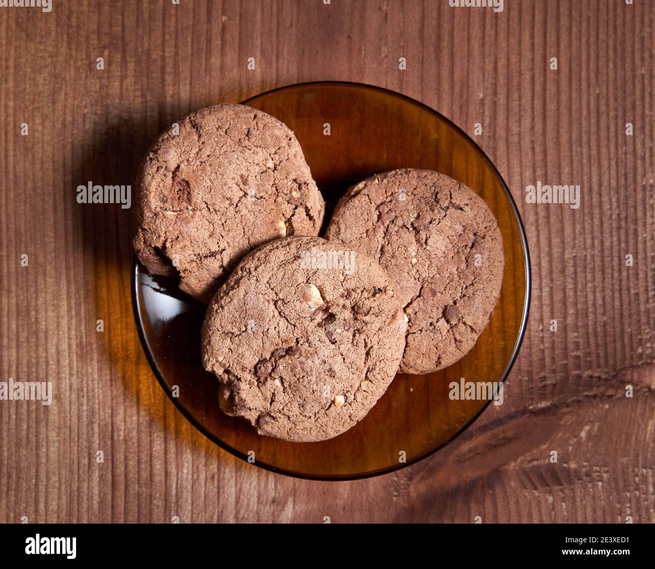 Brown coffee biscuits on a wooden table in closeup Stock Photo - Alamy