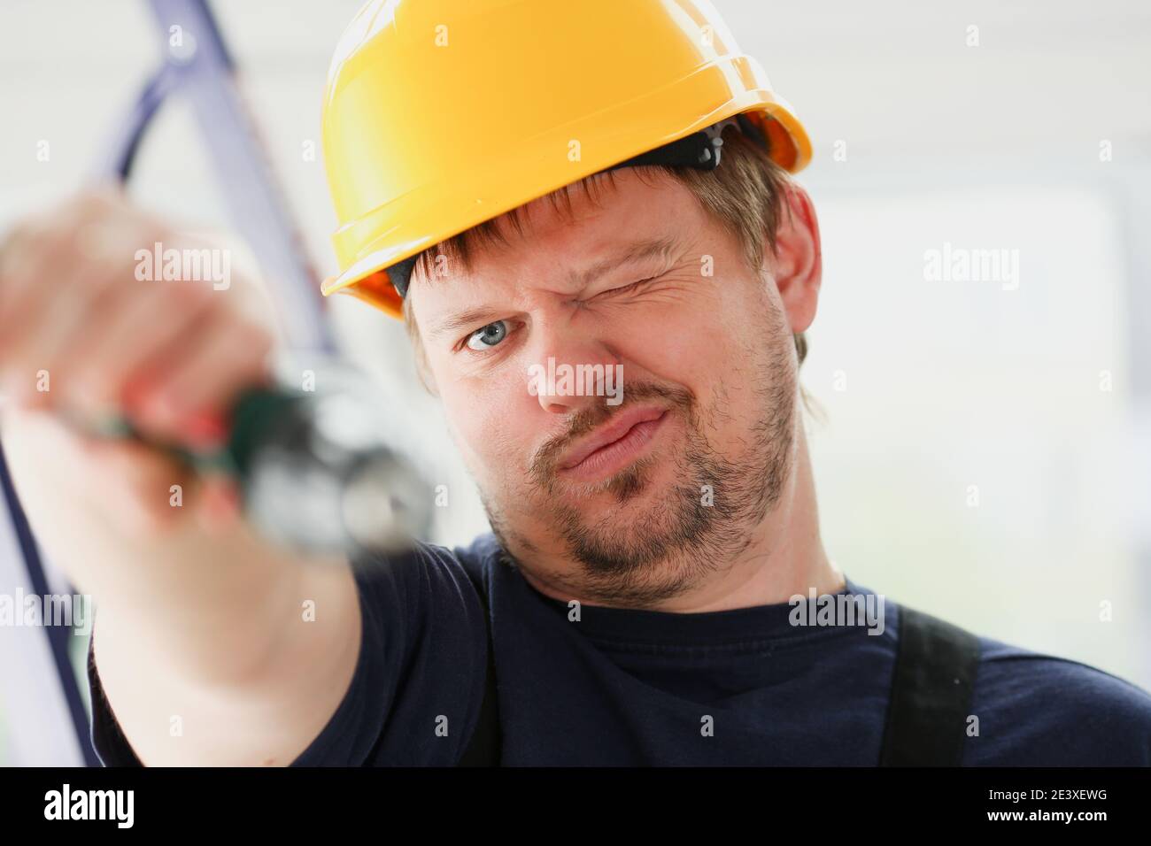 Worker using drill create hi-res stock photography and images - Alamy
