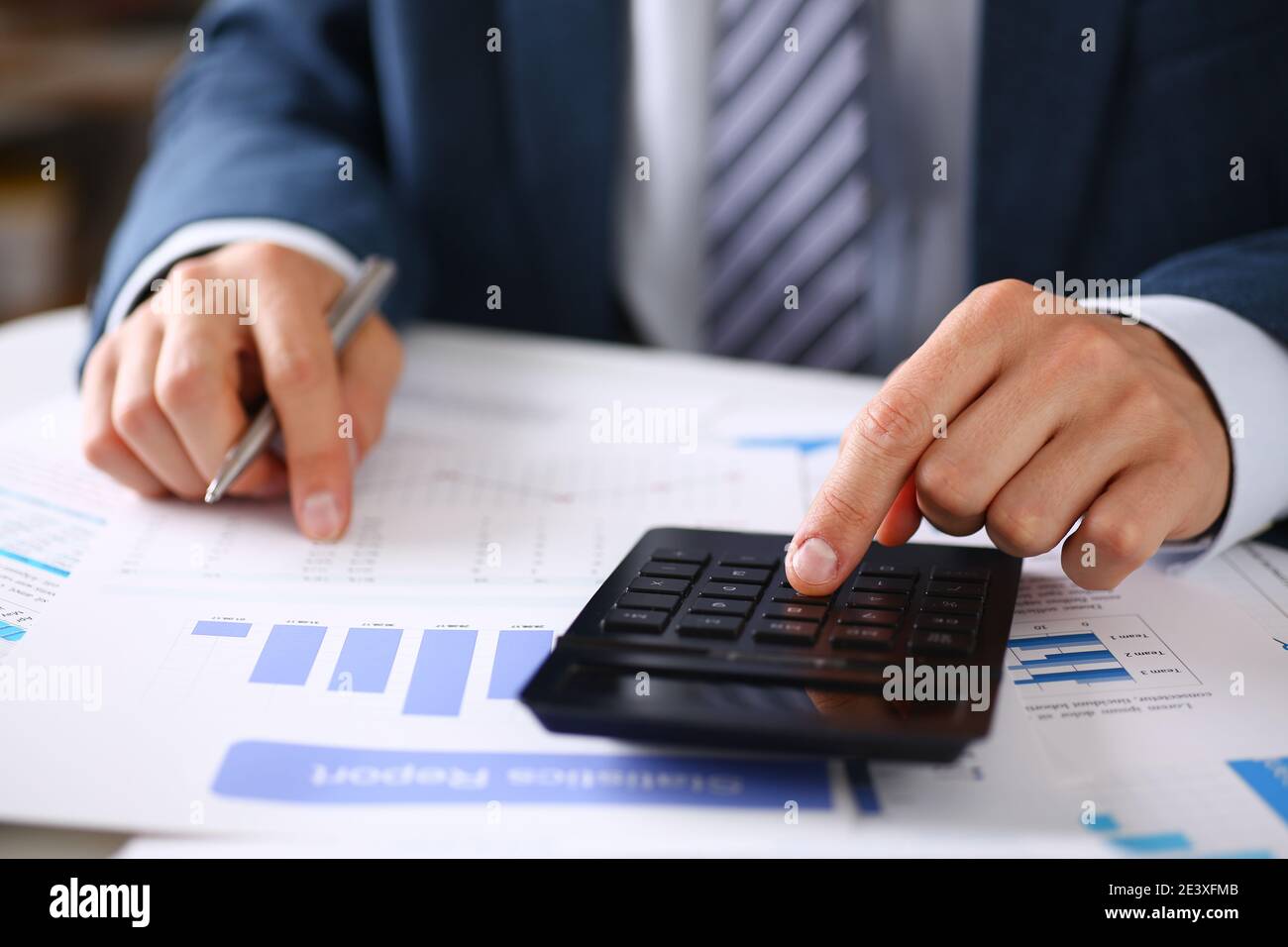 Black calculator and financial statistics on infographics Stock Photo ...