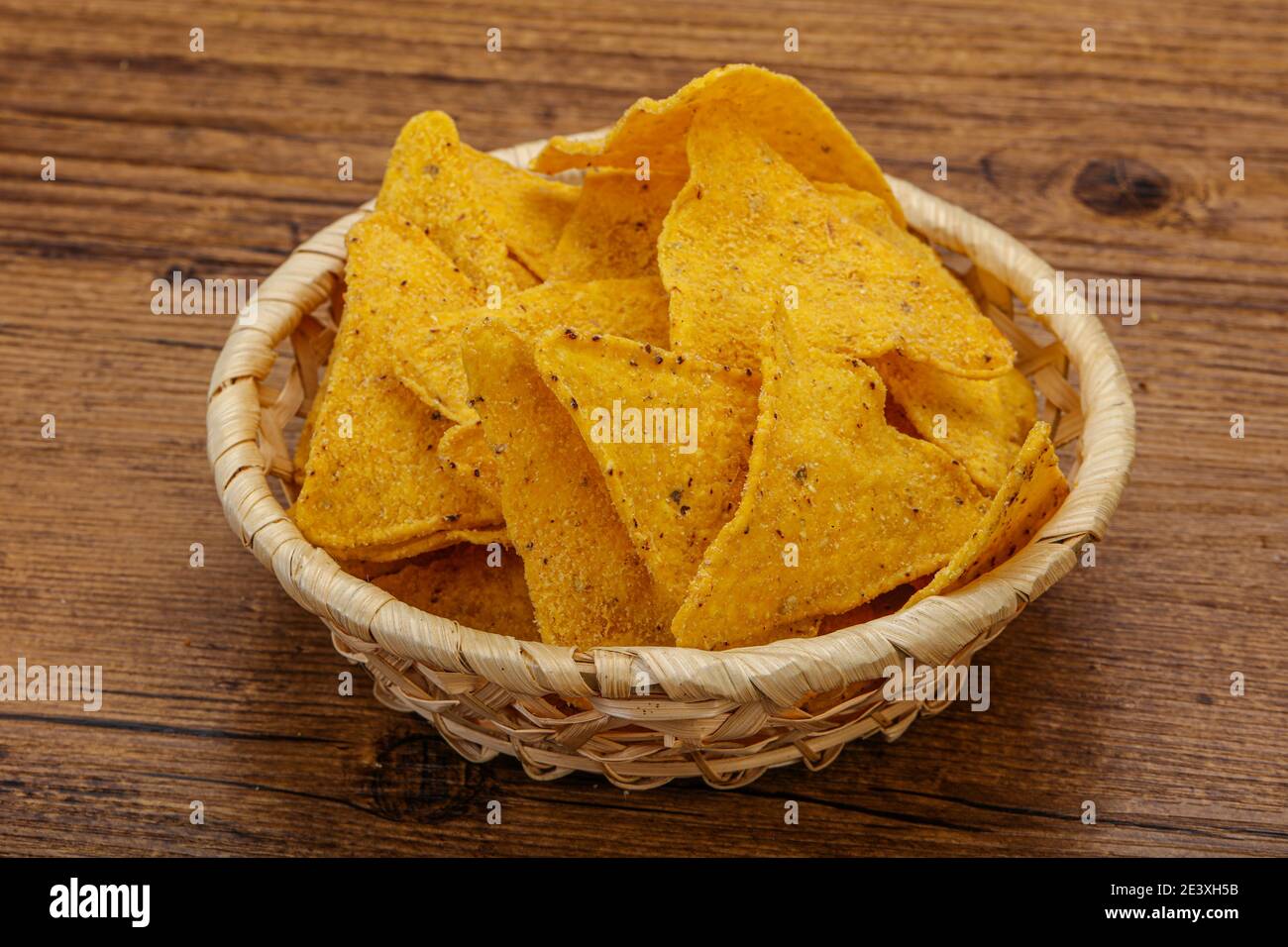 Mexican crunchy corn nachos triangle heap Stock Photo - Alamy